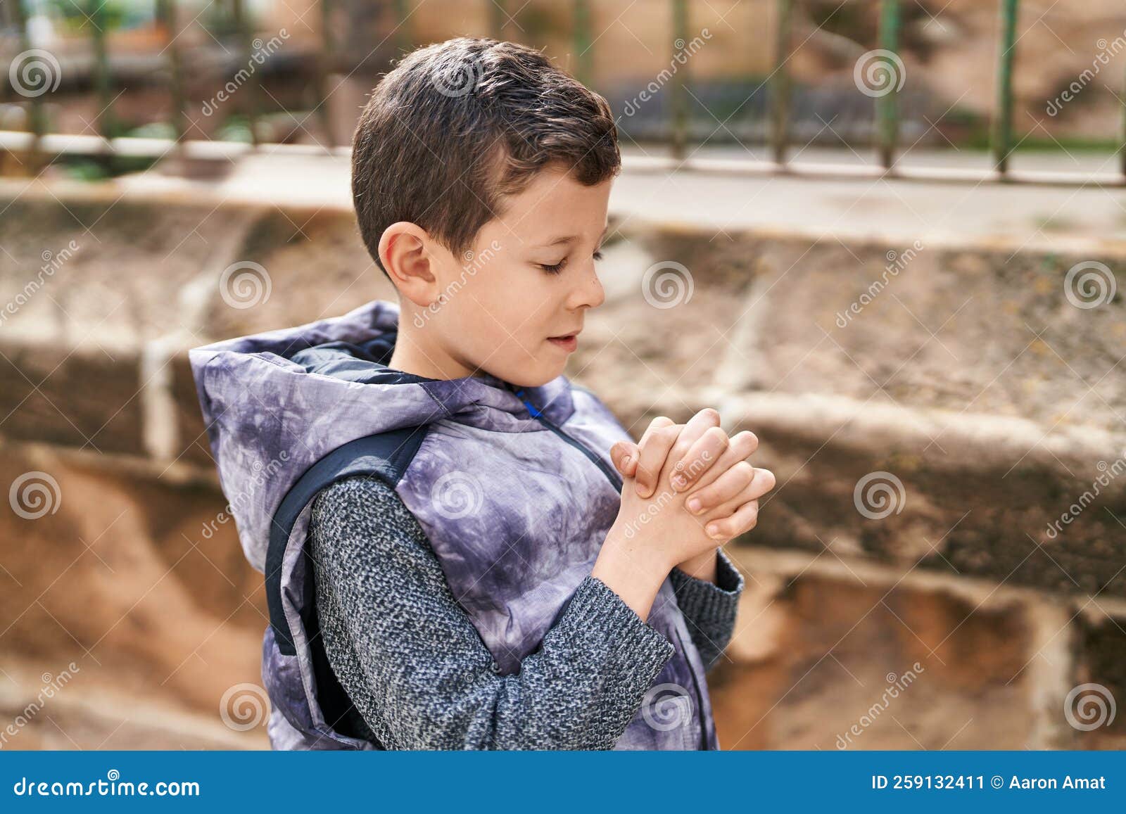 Blond Child Smiling Confident Praying at Street Stock Image - Image of ...