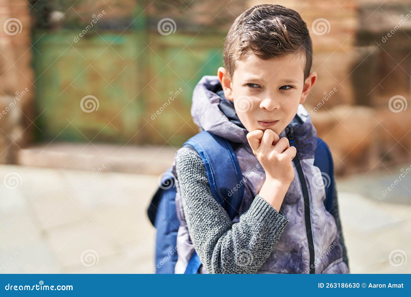 Blond Child Student Standing with Doubt Expression at Street Stock ...