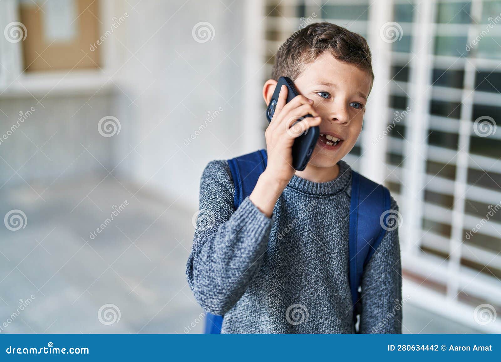 Blond Child Student Talking on the Smartphone at School Stock Photo ...