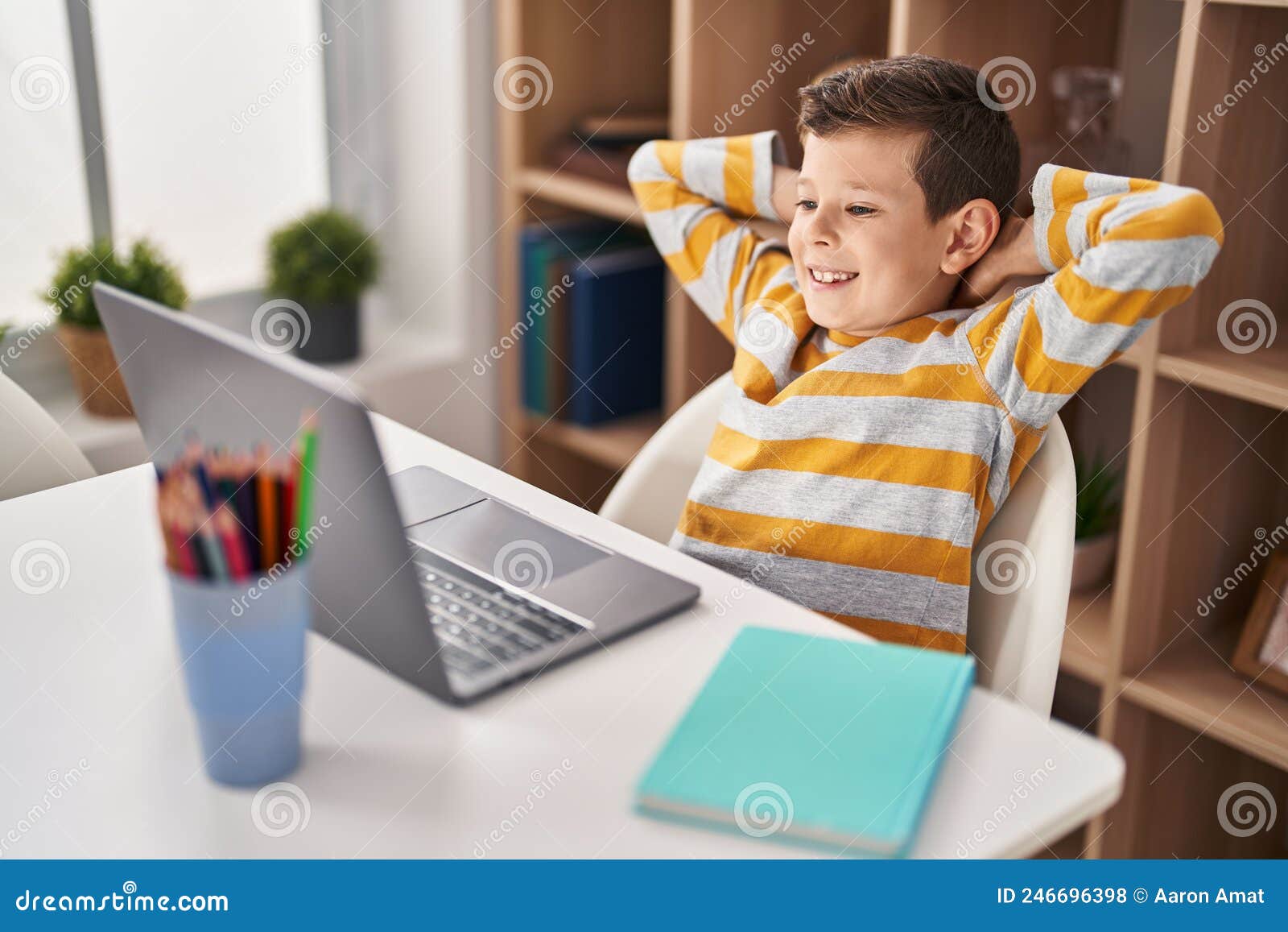 Blond Child Using Laptop Sitting on Table at Home Stock Photo - Image ...