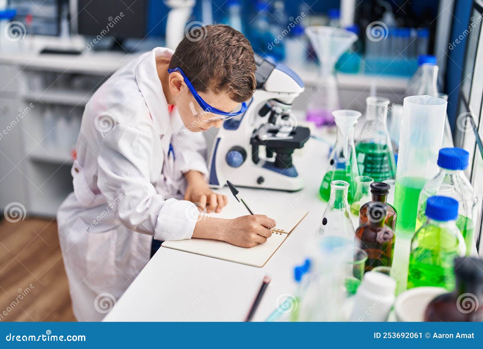 Blond Child Wearing Scientist Uniform Writing on Notebook at Laboratory ...