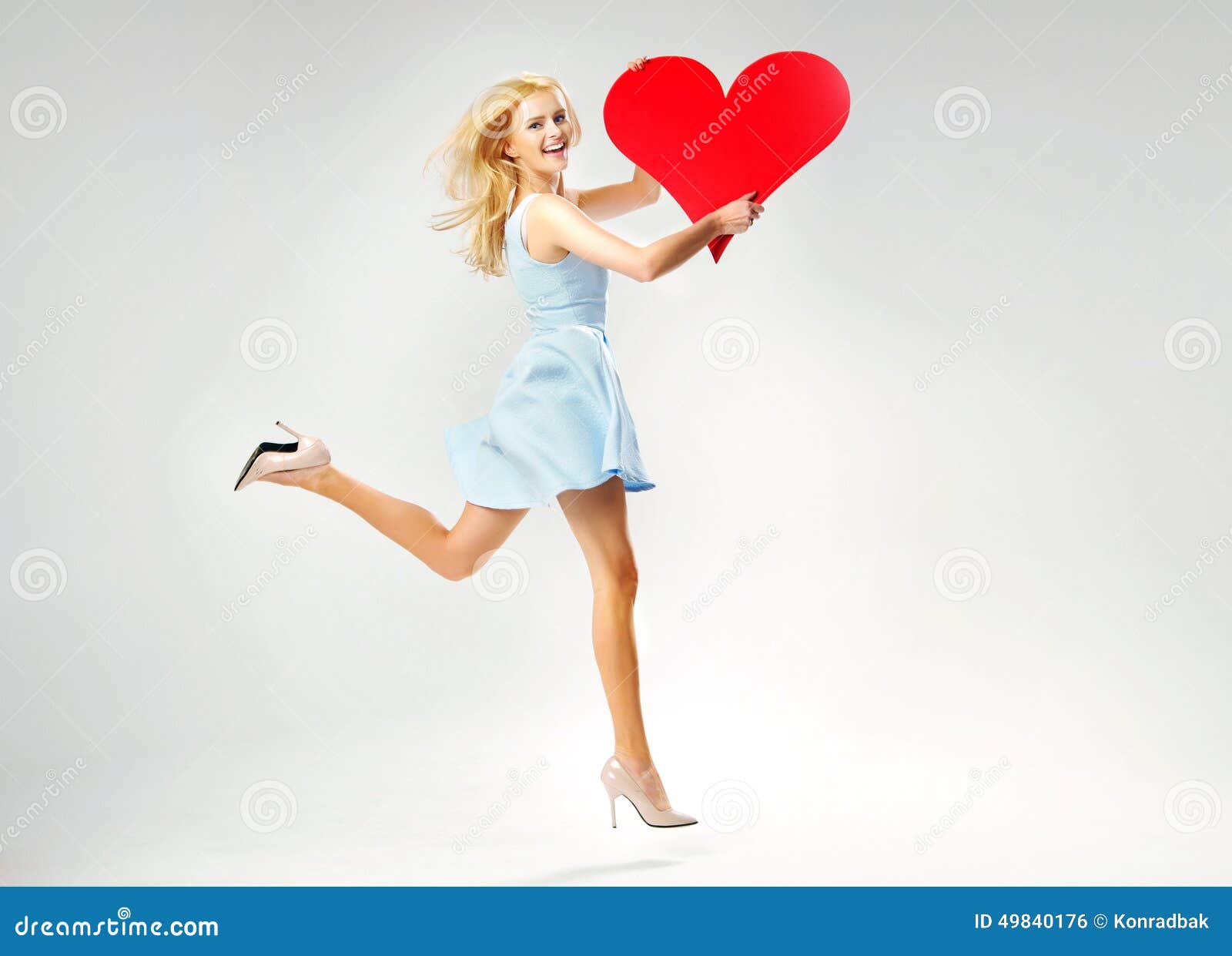 Blond Cute Lady Running with Heart Stock Photo - Image of date, girl ...