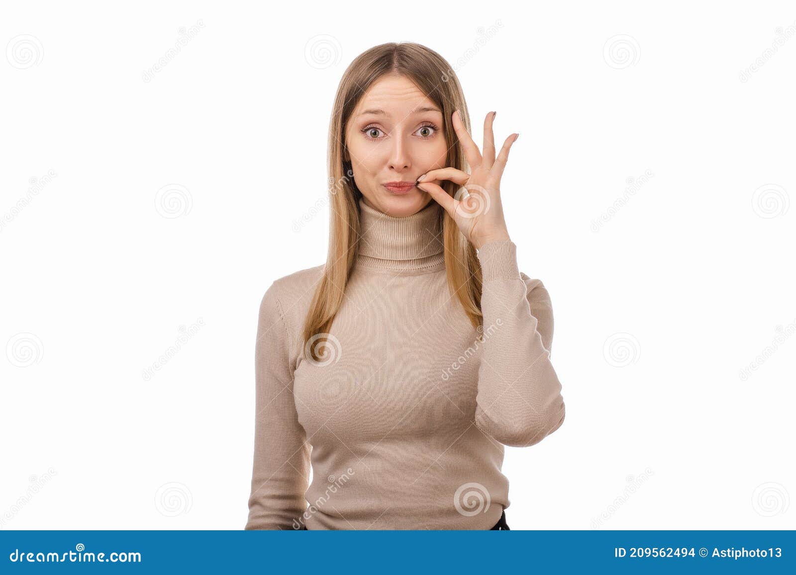 Blond Girl In Casual Clothes Showing Zip Gesture As If Shutting Mouth
