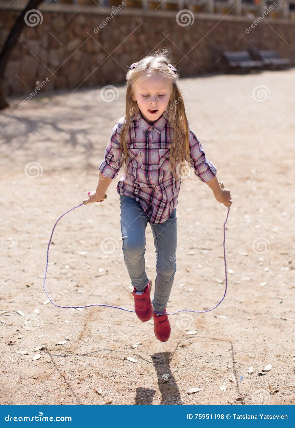 Blond girl jumping rope stock photo. Image of girl, laughing - 75951198