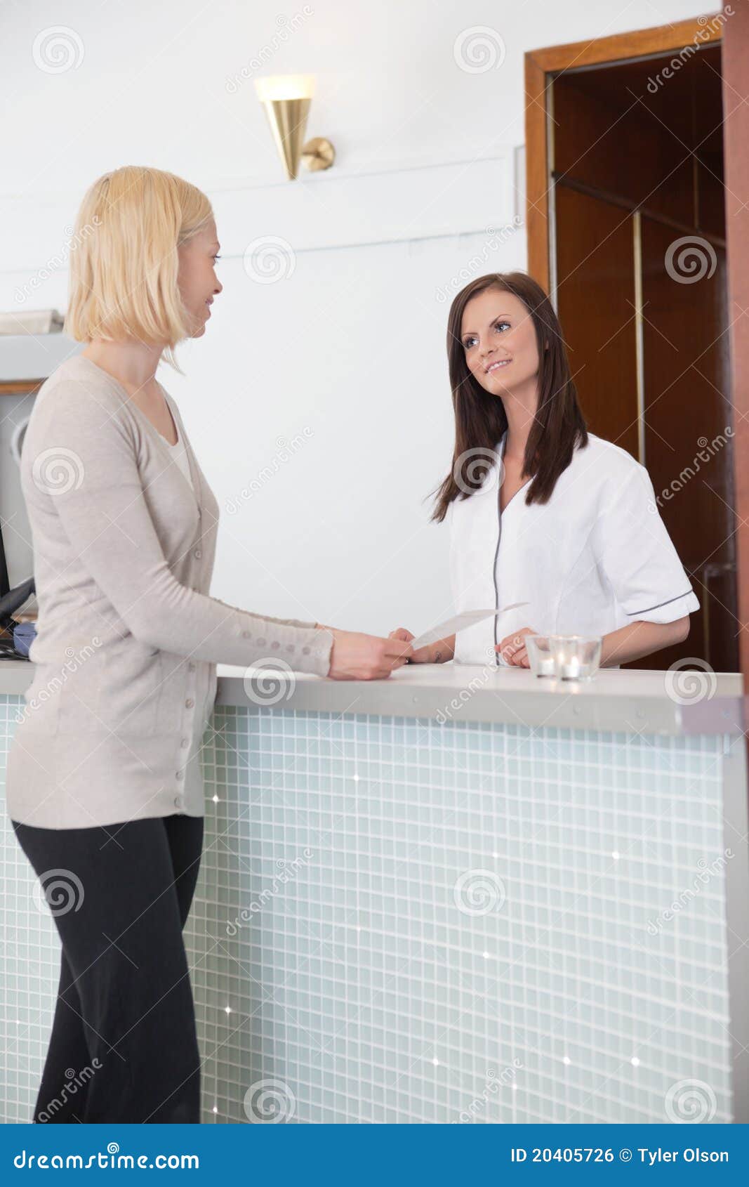 Blond Girl at the Reception Desk Stock Photo - Image of paper ...