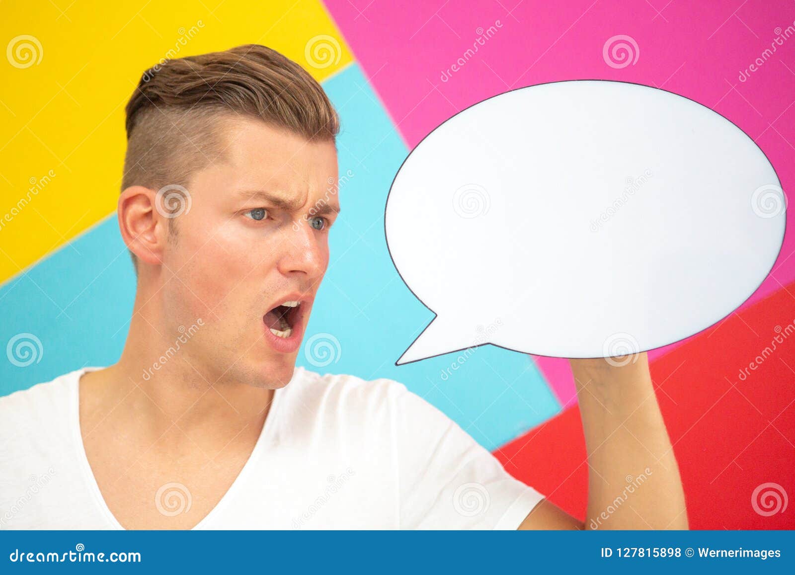 Blond Man Holding a Speech Bubble and is Shouting Stock Photo - Image ...