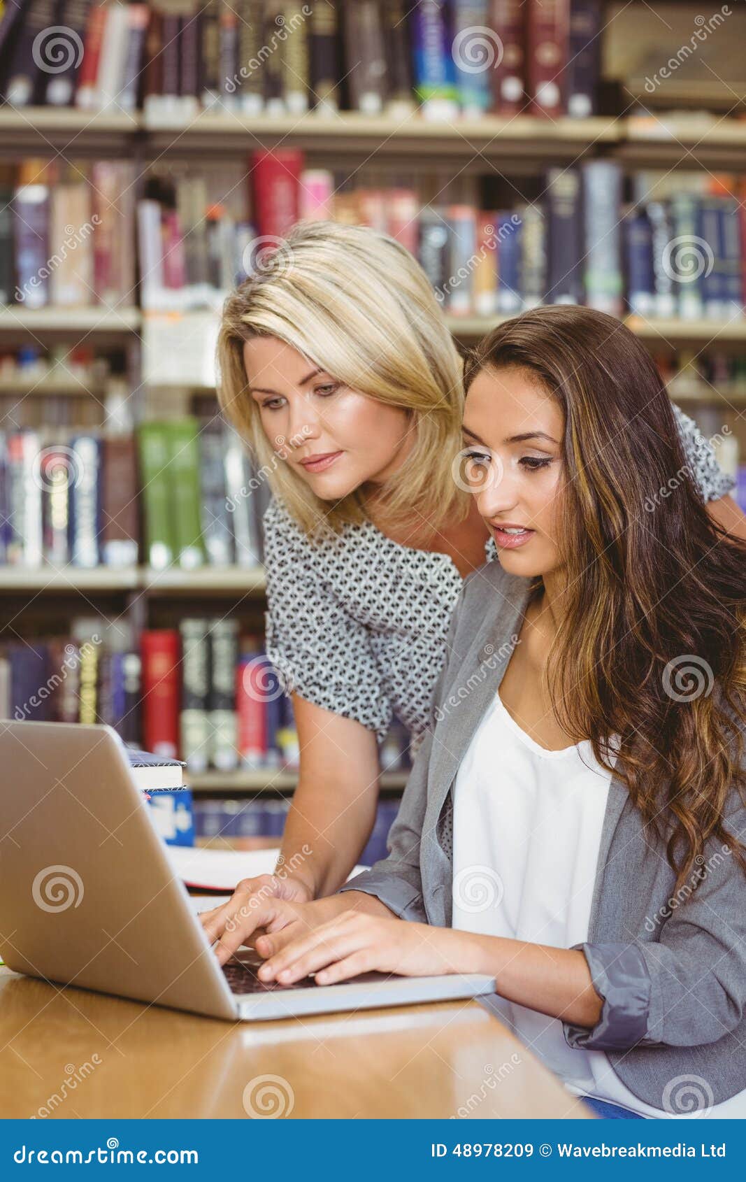 Blond Mature Student Helping Her Classmate Stock Image - Image of ...