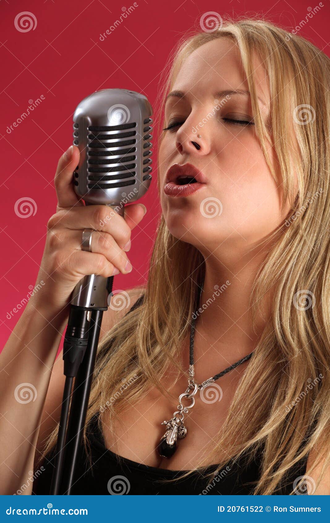 Blond Singing into Retro Microphone Stock Photo - Image of female ...