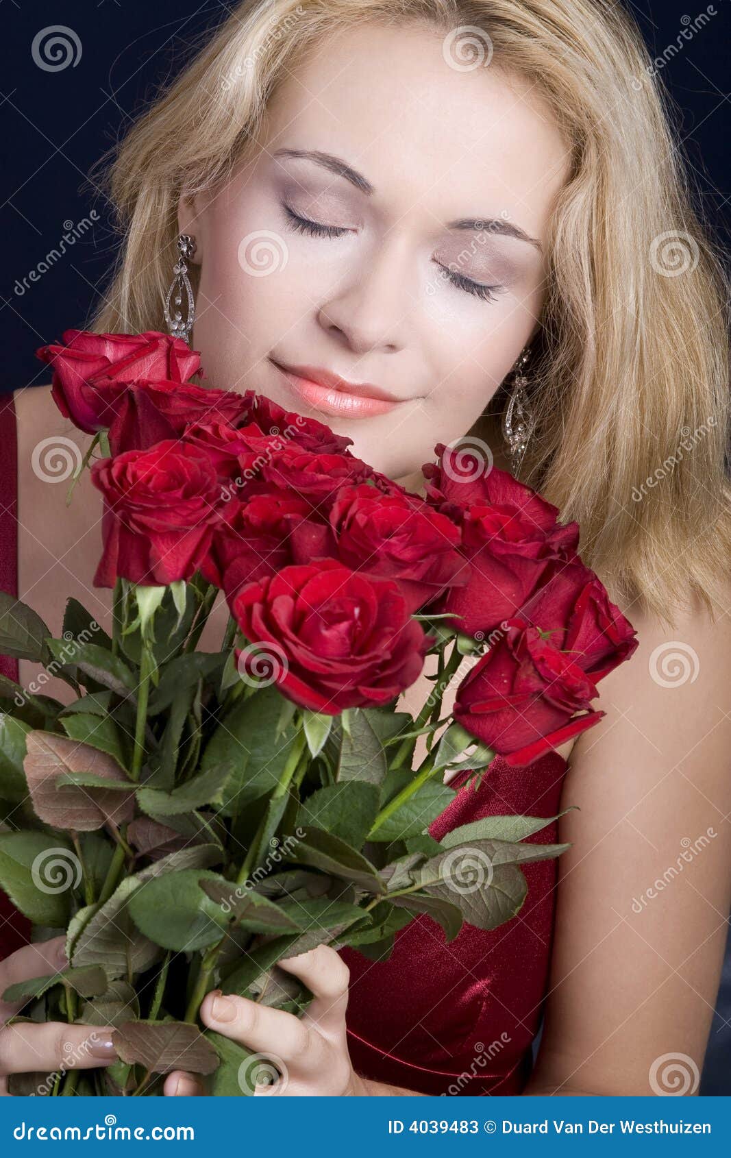 Blond smelling roses stock image. Image of emotion, romance - 4039483