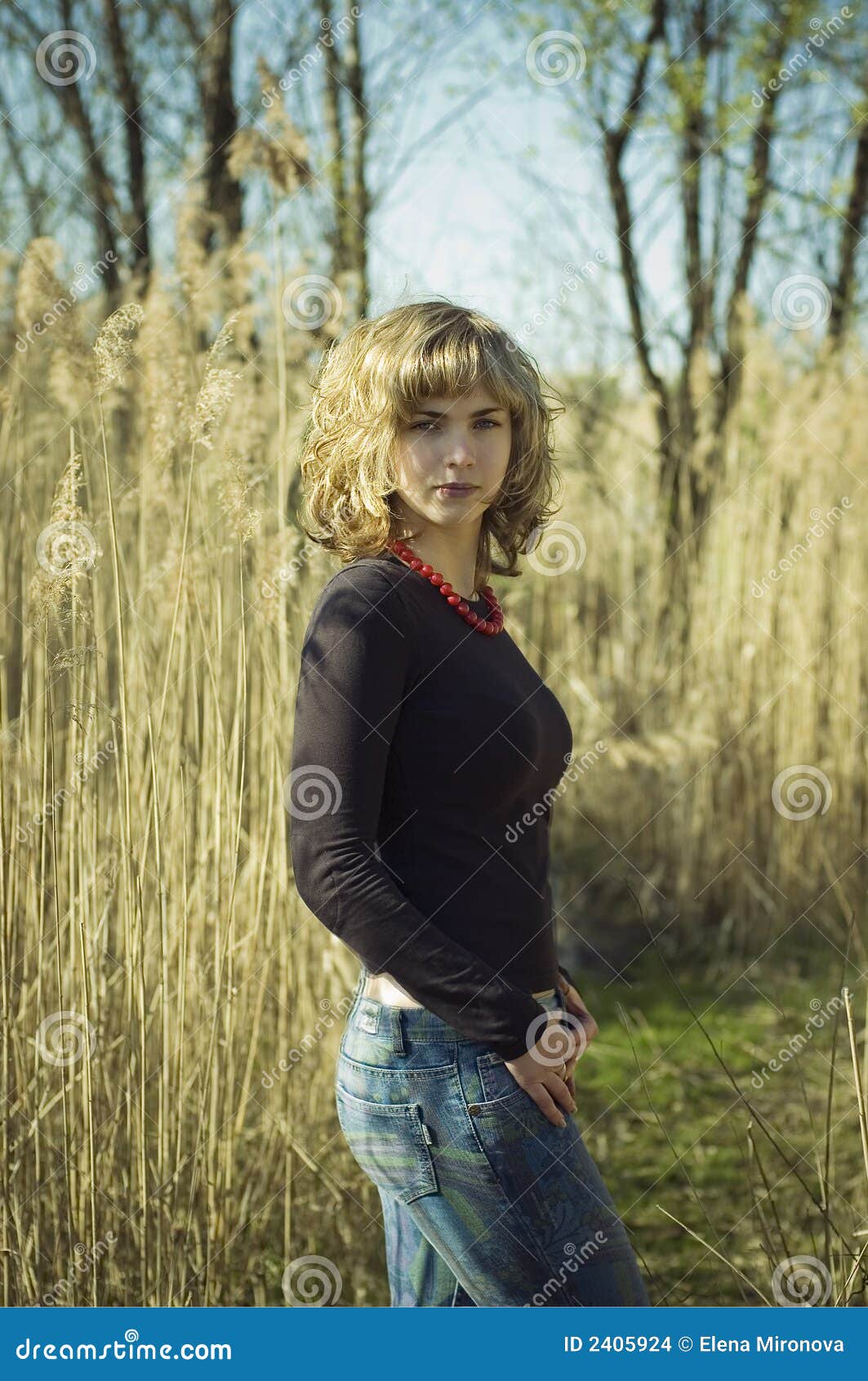 Blond Standing Behind a Reed Stock Photo - Image of beads, person: 2405924