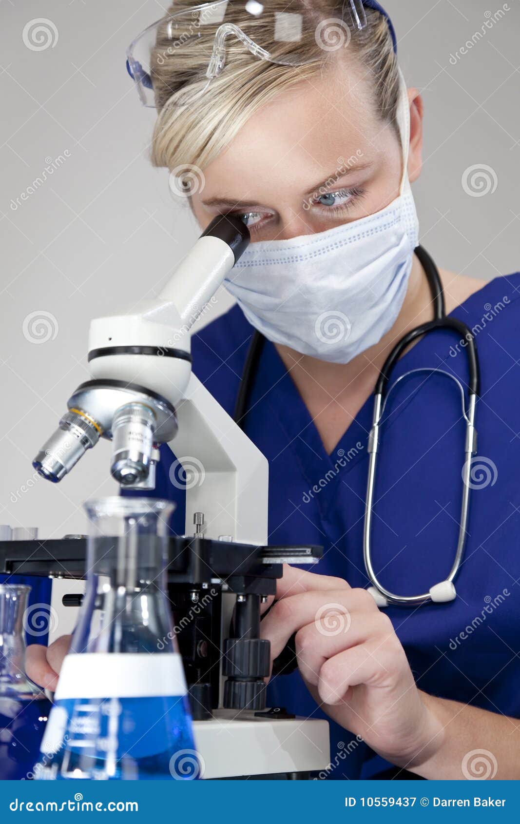 Blond Woman Doctor Using Microscope Stock Image - Image of ...