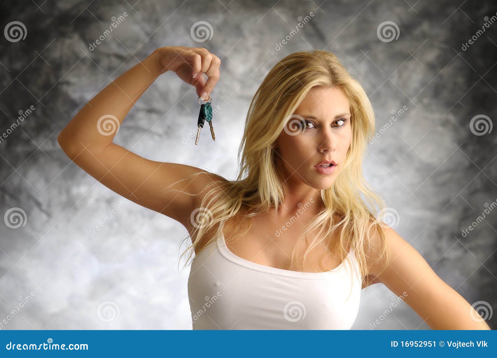 Blond woman with the key stock image. Image of white - 16952951