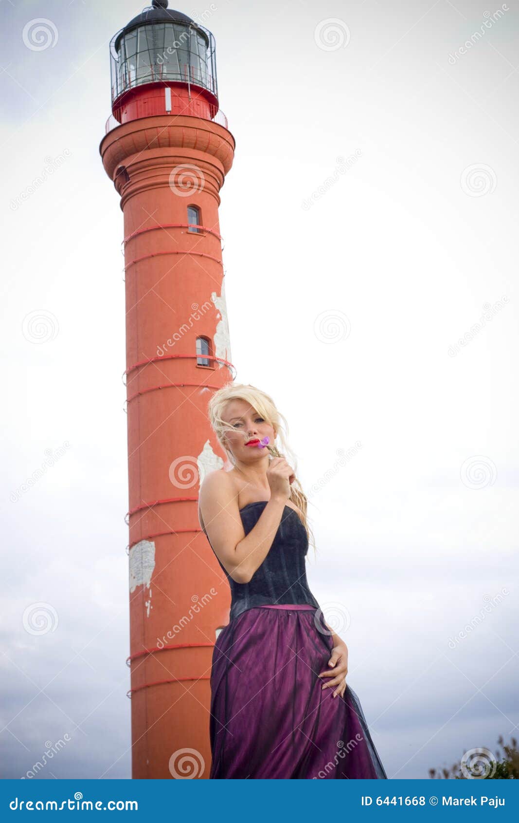 Blond woman at lighthouse stock photo. Image of model - 6441668