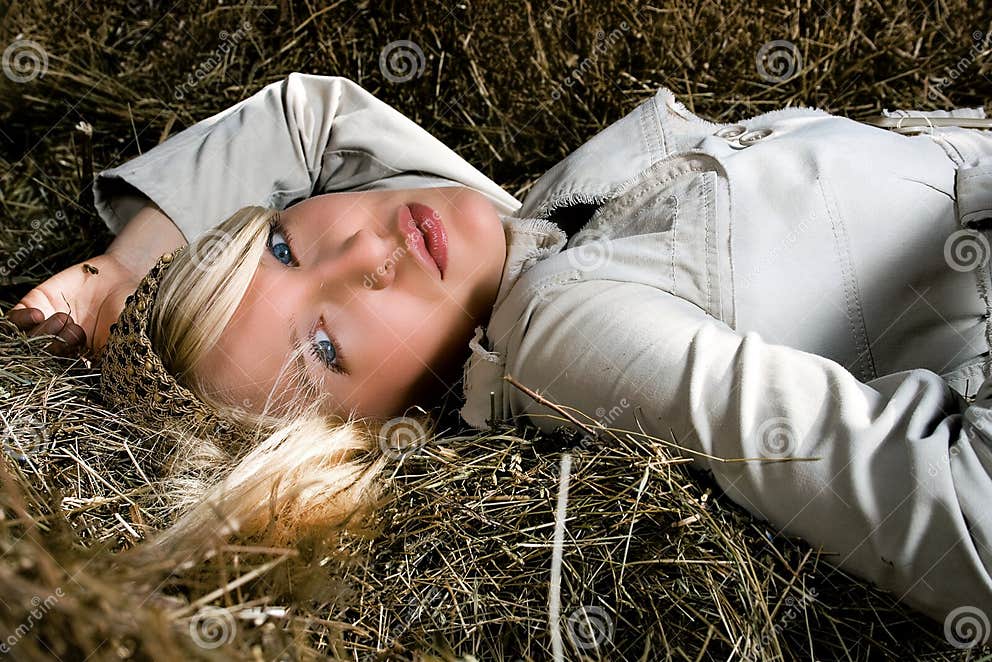 Blond Woman Lying on Haystack Stock Image - Image of outside, dream ...