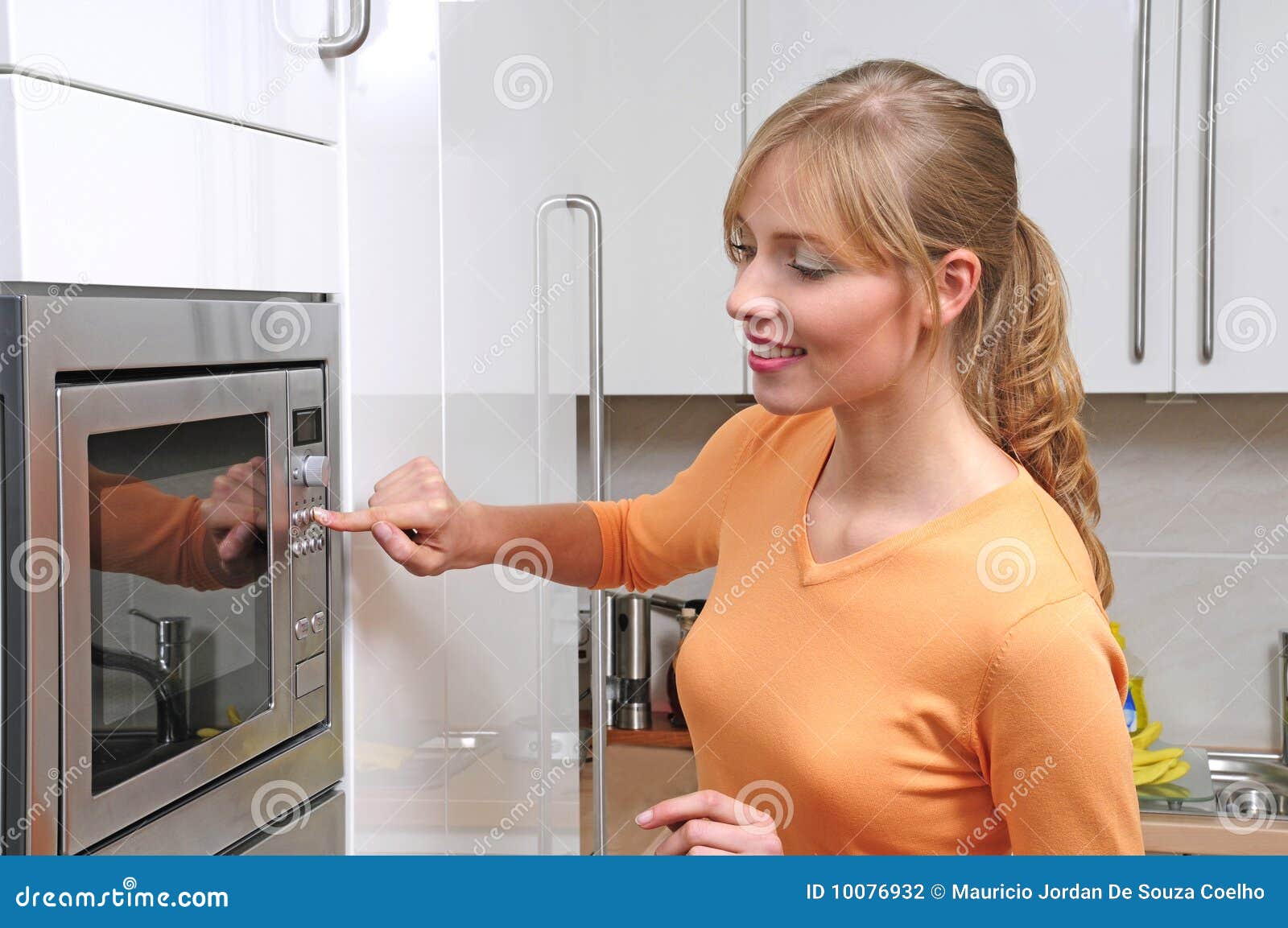 Blond Woman with a Microwave Stock Photo - Image of friendly, enjoy ...
