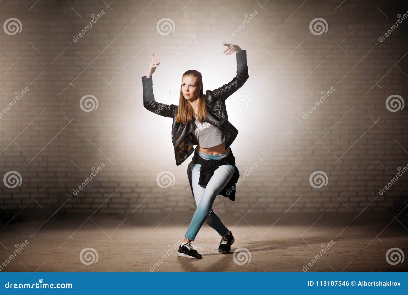 Blond Woman Raising Her Arms and Doing Basic Steps of Break Dance Stock ...