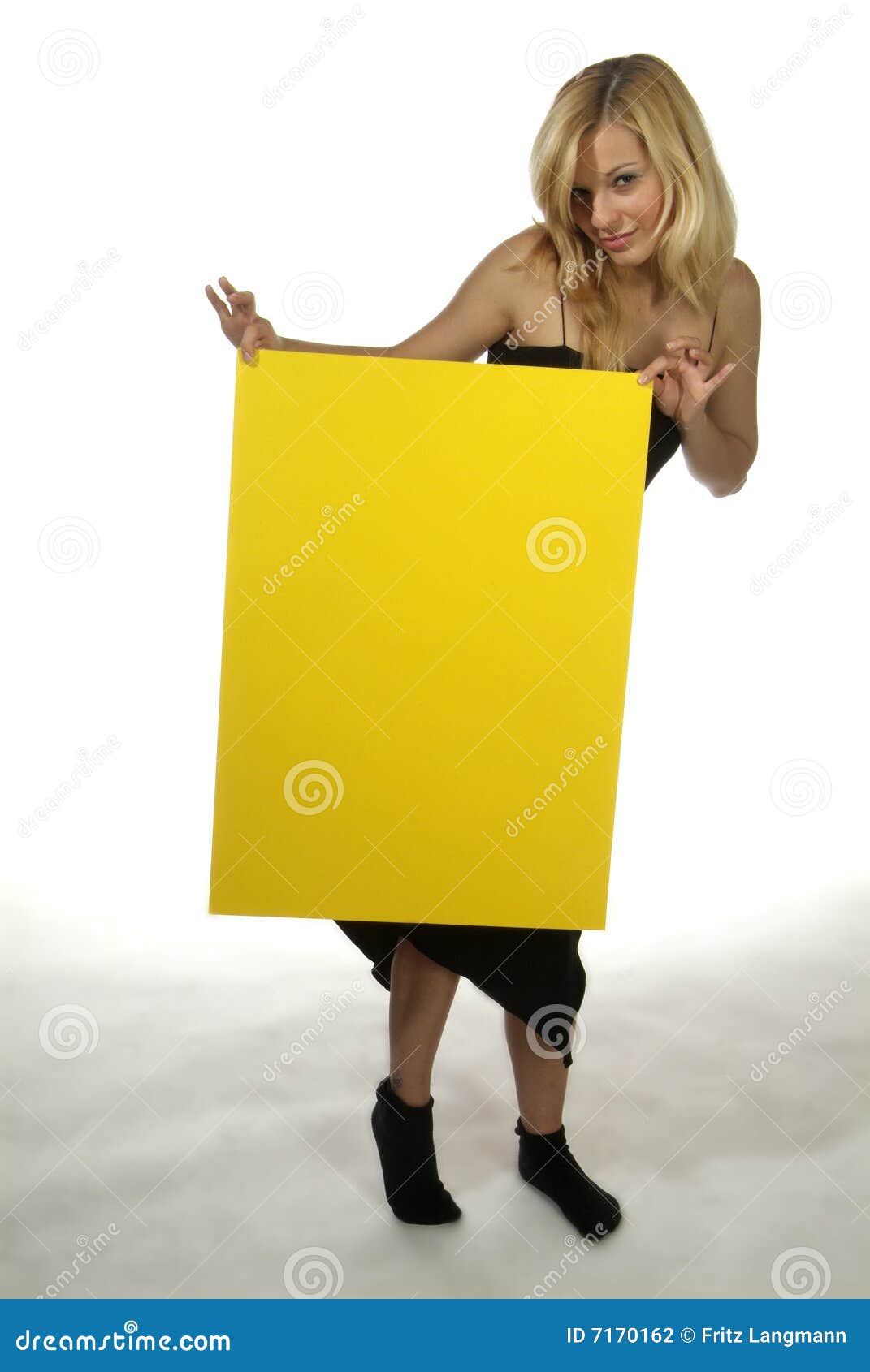 Blond woman yellow sign stock photo. Image of interior - 7170162