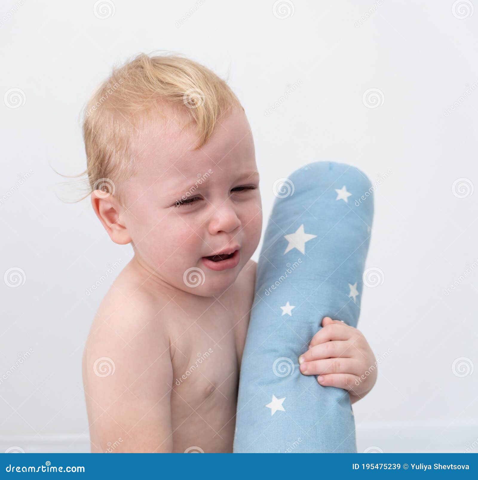 Blonde Baby Boy Crying Hugging a Pillow. Stock Image - Image of ...