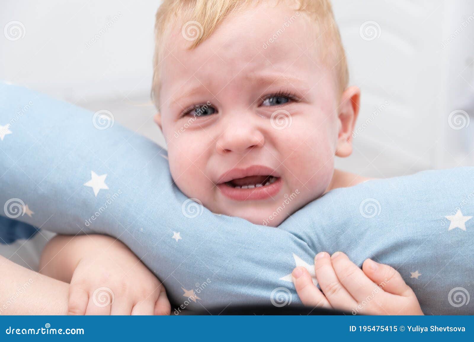 Blonde Baby Boy Crying Hugging a Pillow. Stock Image - Image of ...