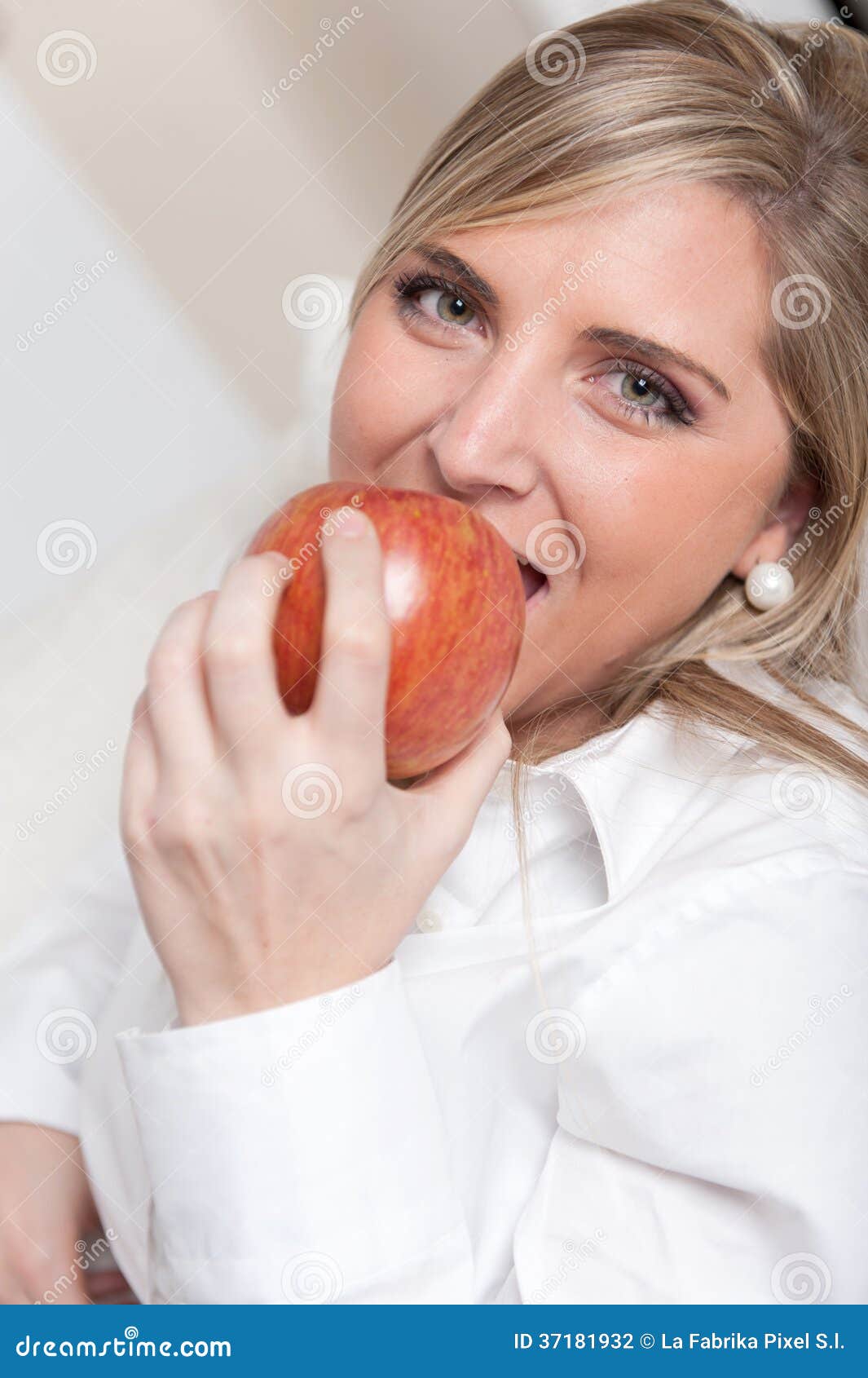 Blonde biting an apple stock photo. Image of girl, fresh - 37181932