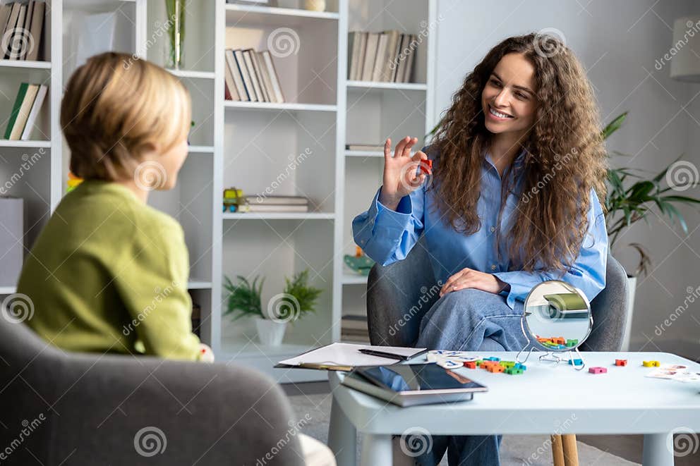 Blonde Boy Having a Speech Tutorial with a Female Speech Therapist ...