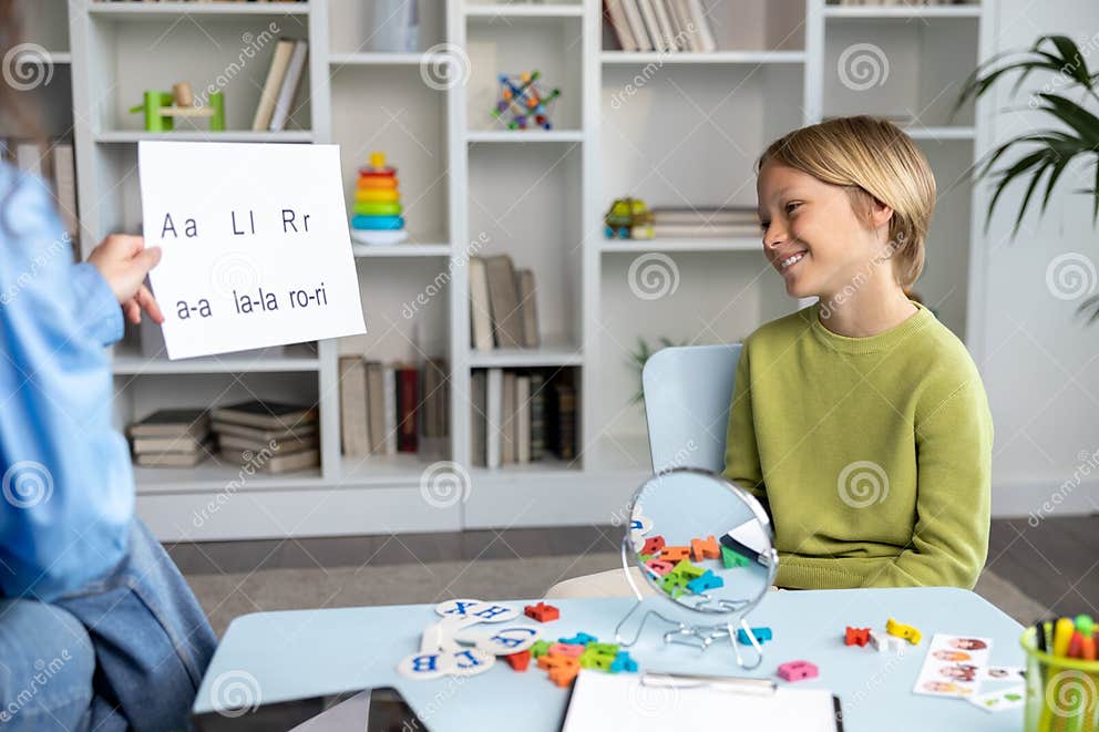 Blonde Boy Having a Speech Tutorial with a Female Speech Therapist ...
