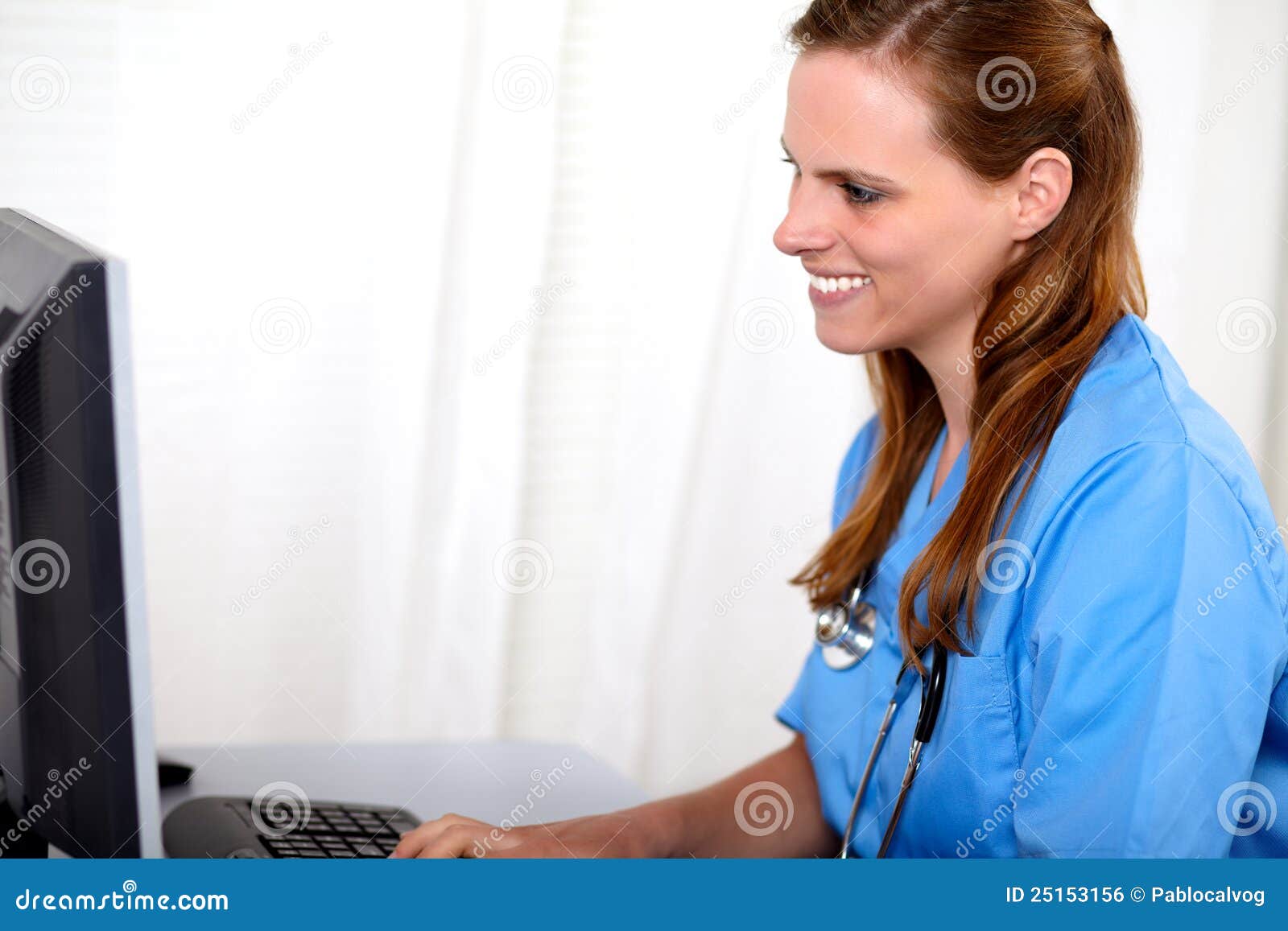 Blonde Friendly Nurse Looking To Computer Stock Photo - Image of ...