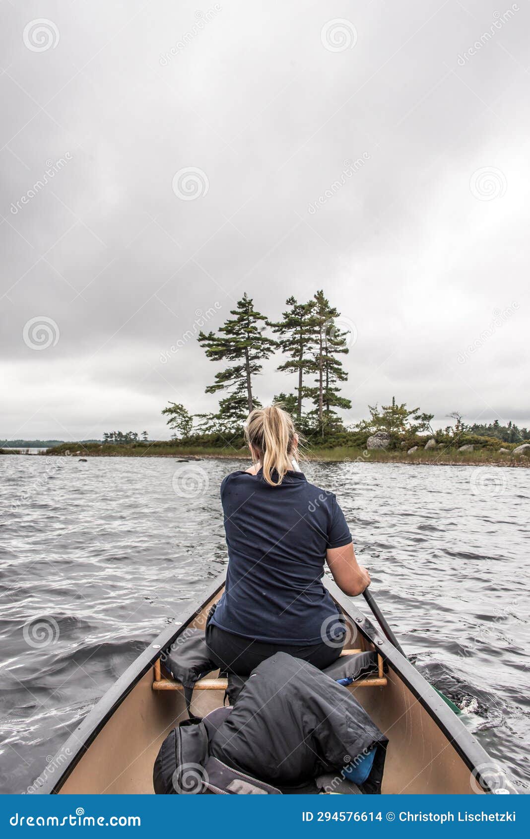 Blonde Girl Canoe Ride Exploring Nature On Morning Mist Kejimkujik