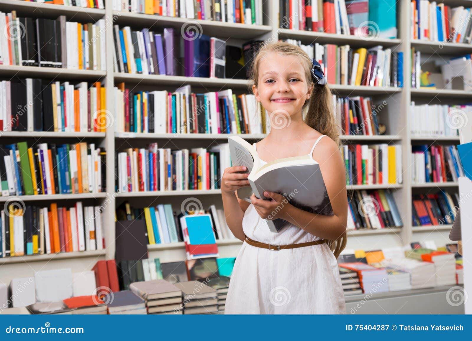 Blonde Girl Chooses a Book in the Library Stock Image - Image of ...