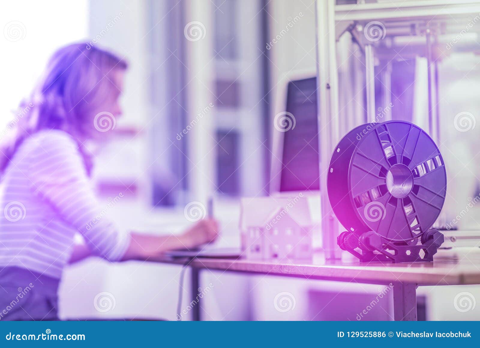 Blonde-haired Female Software Engineer Sitting at the Table in Front of ...