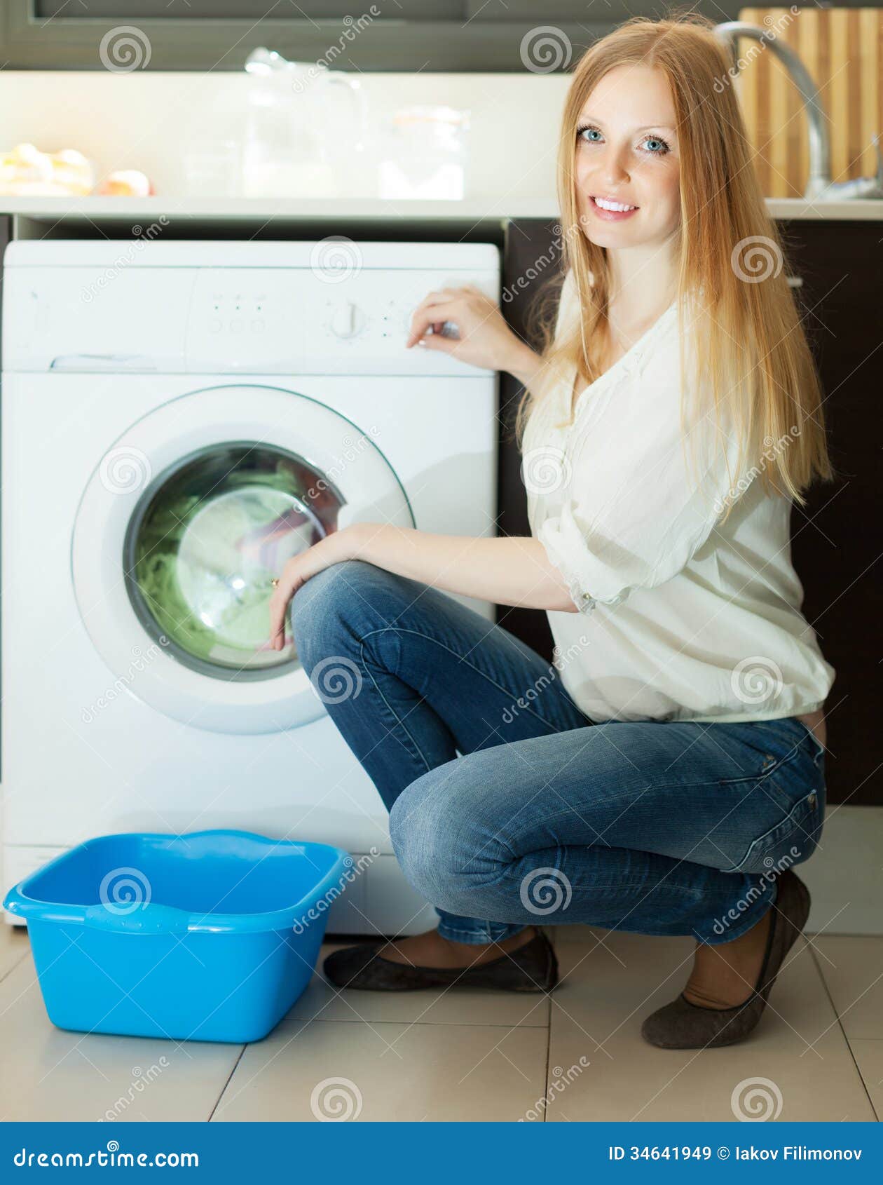 Blonde Long-haired Woman Using Washing Machine at Home Stock Image ...