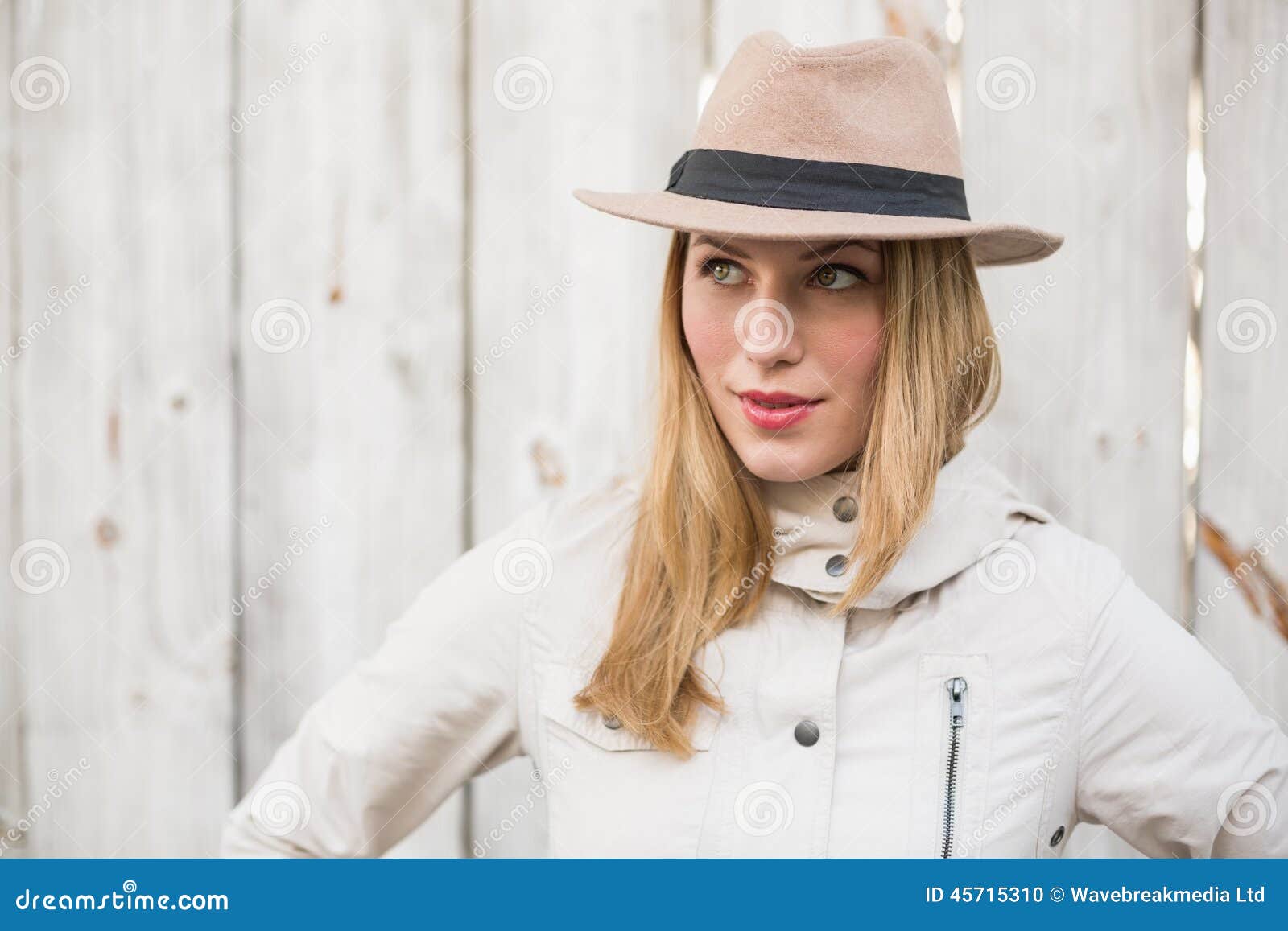 Blonde Model Posing with Hand on Hips while Looking Away Stock Photo ...