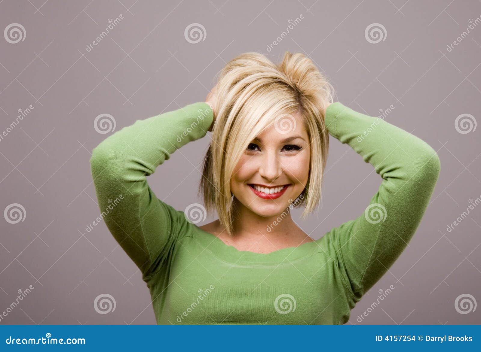 Blonde Mussing Hair Hands Behind Head Stock Photo - Image of miss ...