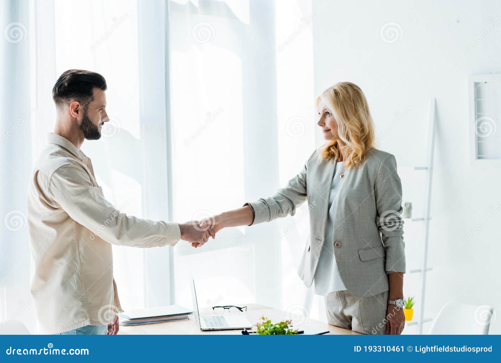 Blonde Recruiter and Handsome Employee Shaking Hands Stock Image ...
