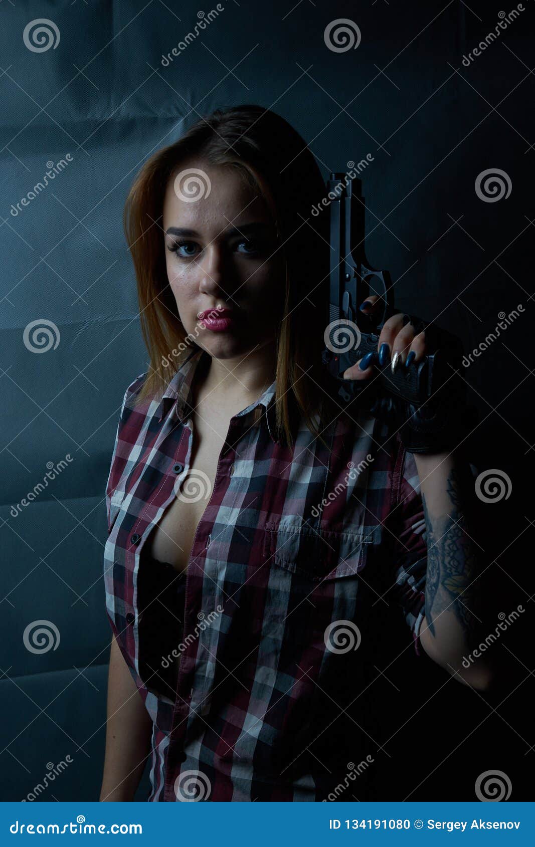 Blonde with a rifle gun stock photo. Image of model - 134191080