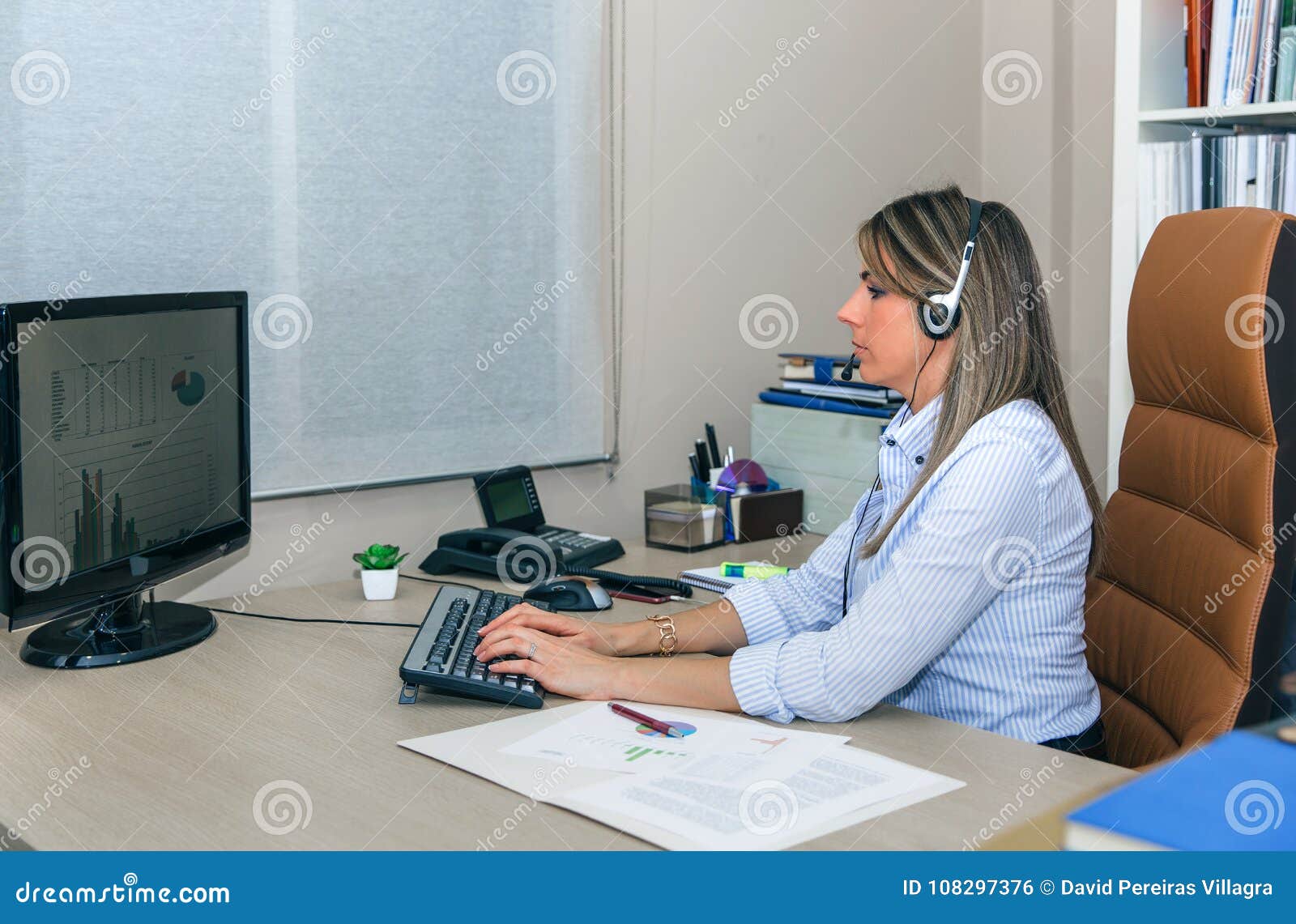 Blonde Secretary Working with Computer in Office Stock Photo - Image of ...