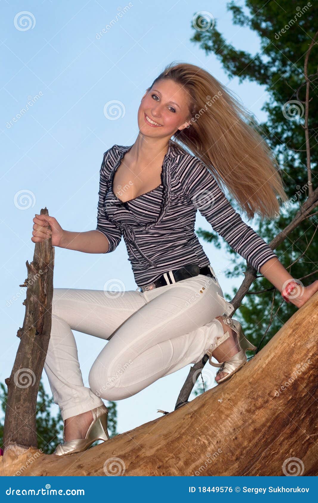 Blonde Sitting on a Tree Branch Stock Photo - Image of beauty, natural ...