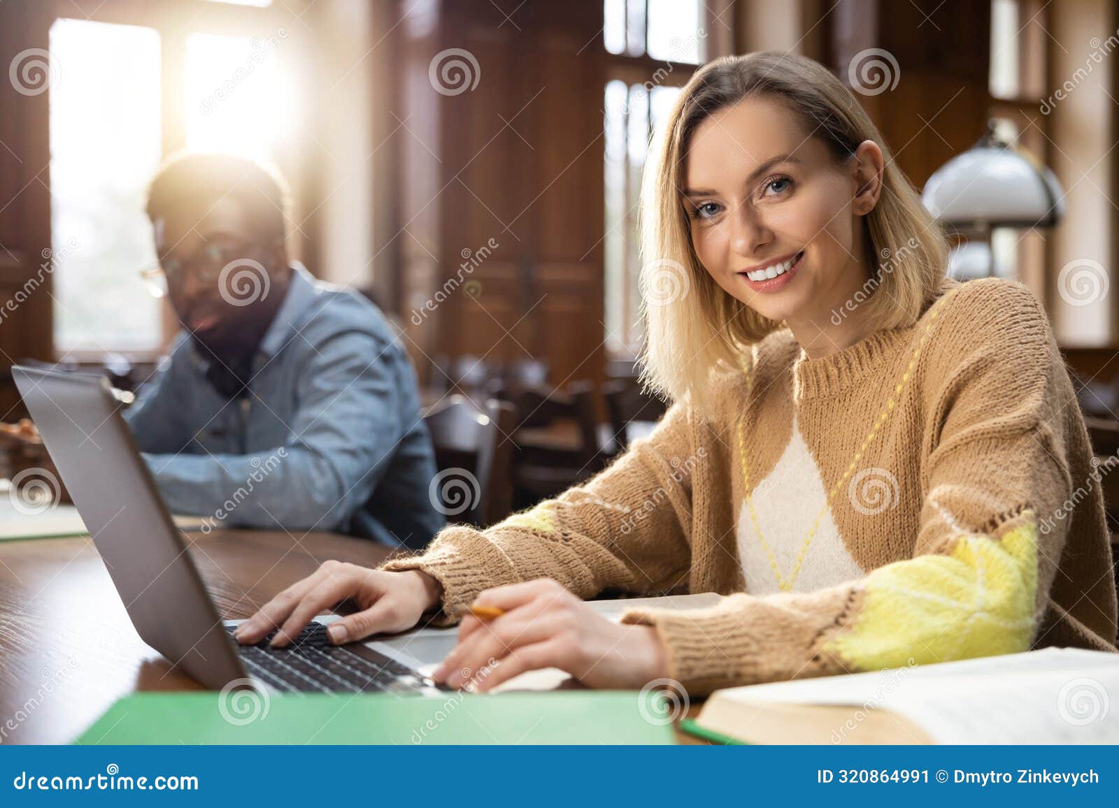 Blonde Smiling Woman at the Laptop in the Library Stock Image - Image ...