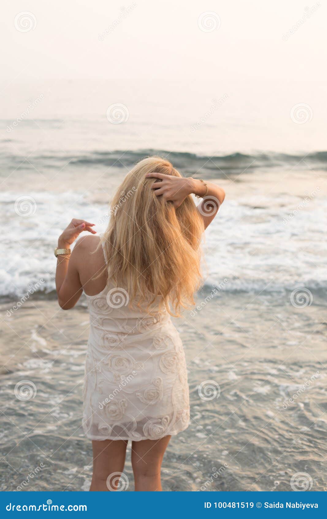 Blonde Woman Brushing Hair With Her Hand Stock Image Image Of