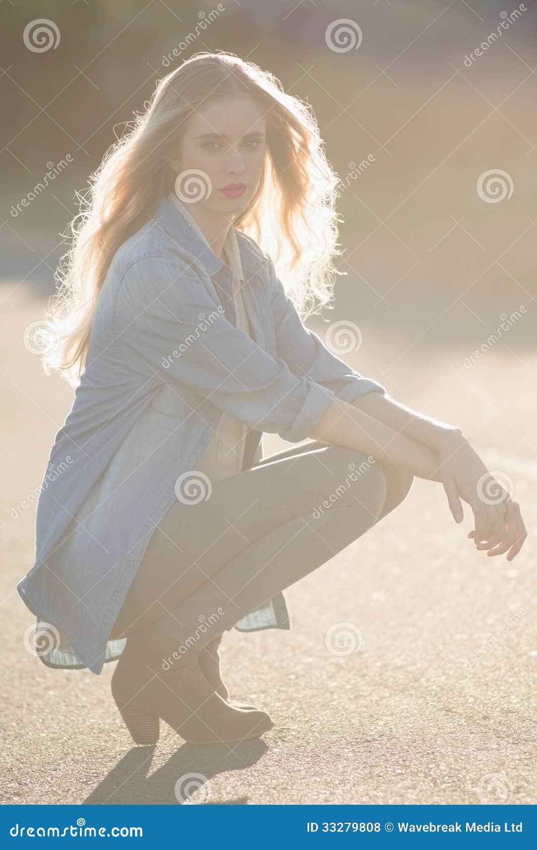 Blonde Woman Crouching Down on a Highway Stock Photo - Image of women ...