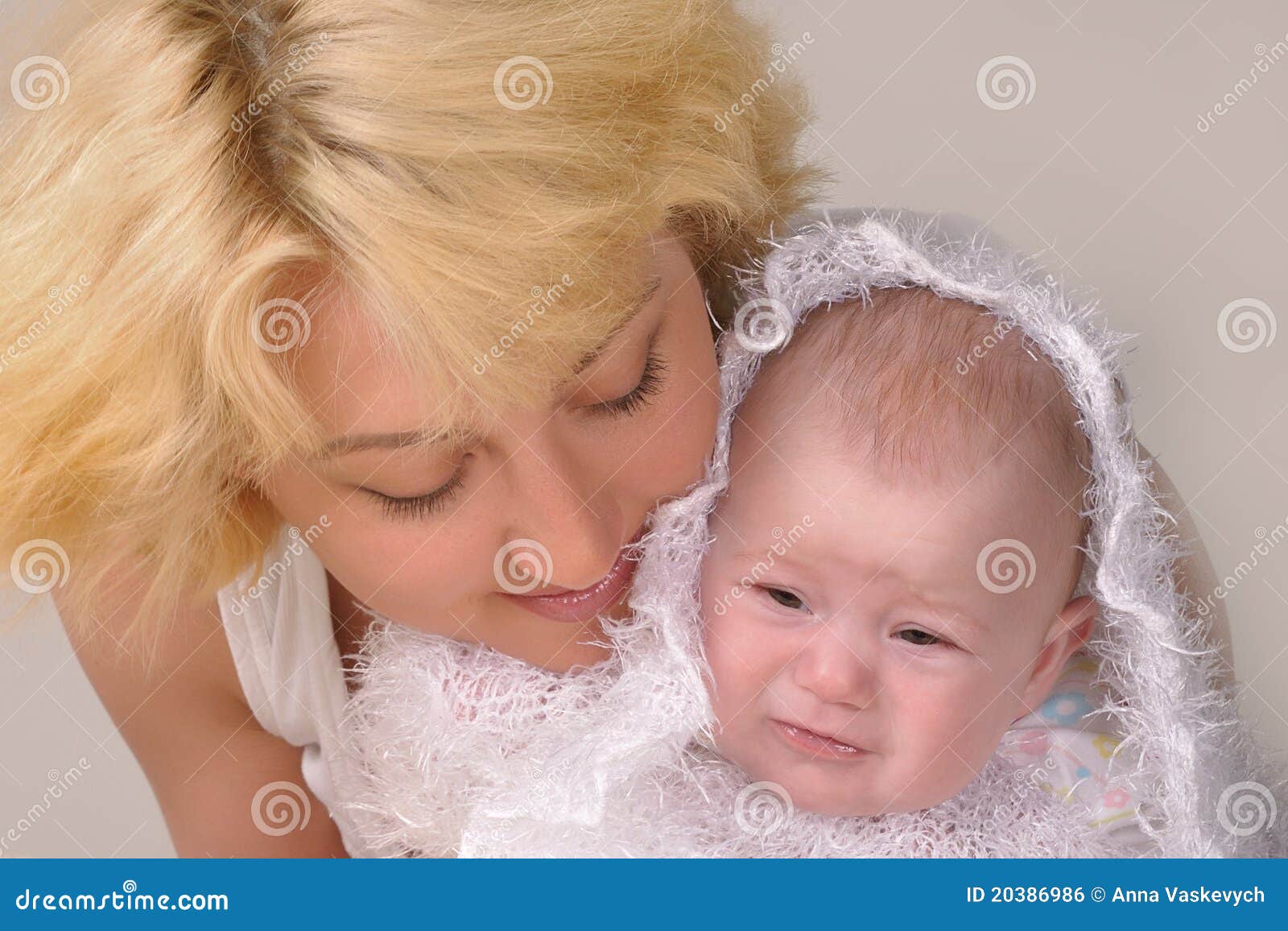 Blonde woman with her baby stock photo. Image of face - 20386986