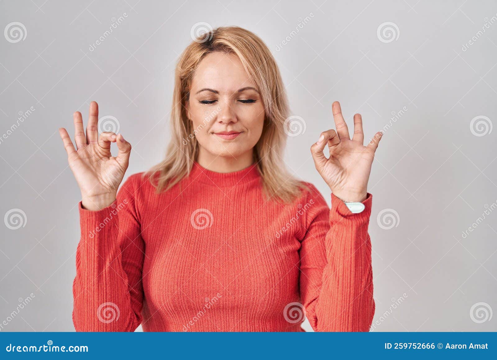 Blonde Woman Standing Over Isolated Background Relaxed And Smiling With