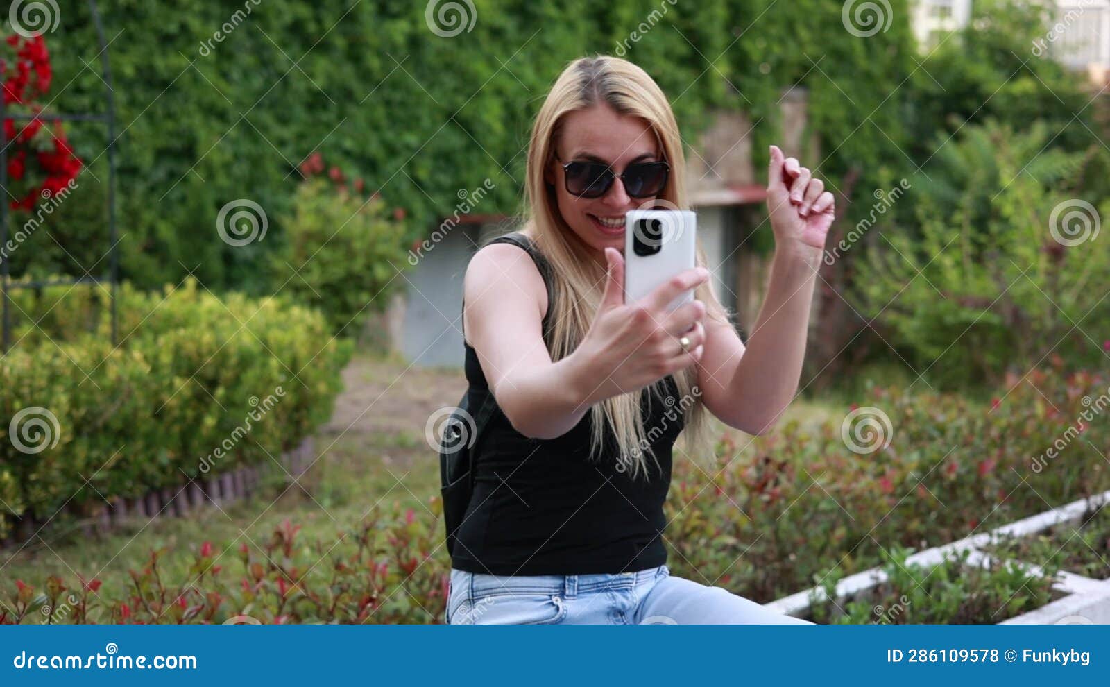 Blonde Woman Taking Selfies In The Park Video Stock Footage Video Of