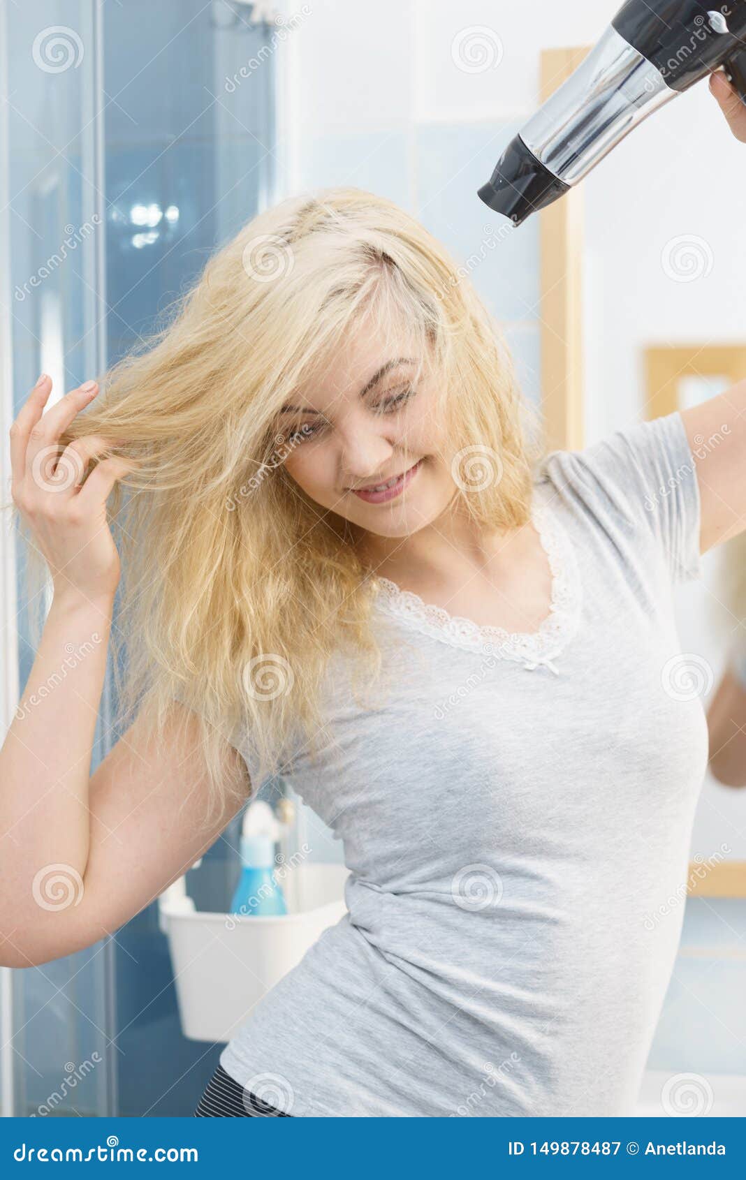 Blonde Woman Using Hair Dryer Stock Image Image Of Happy Bathroom