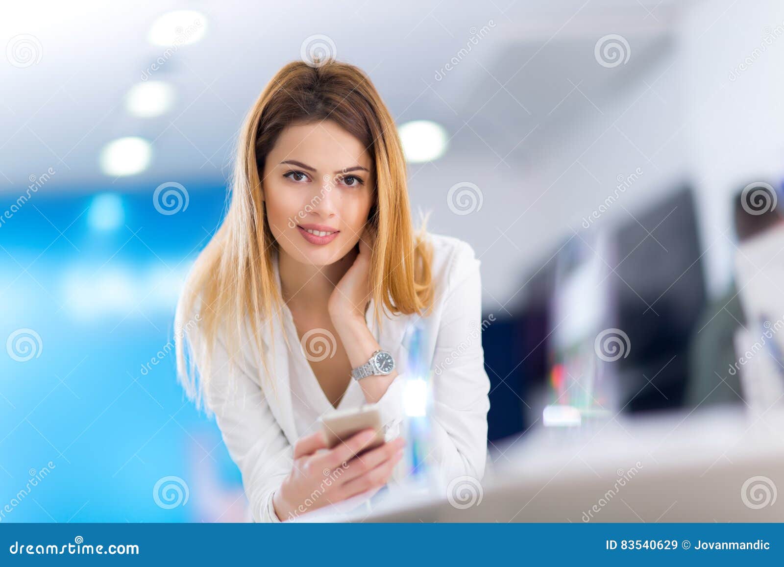 Blonde Woman Using on Smart Phone in Store. Stock Image - Image of ...