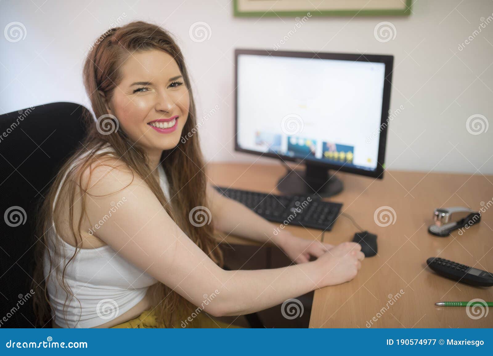 Blonde Woman Working at Computer Looking at Camera Stock Image - Image ...