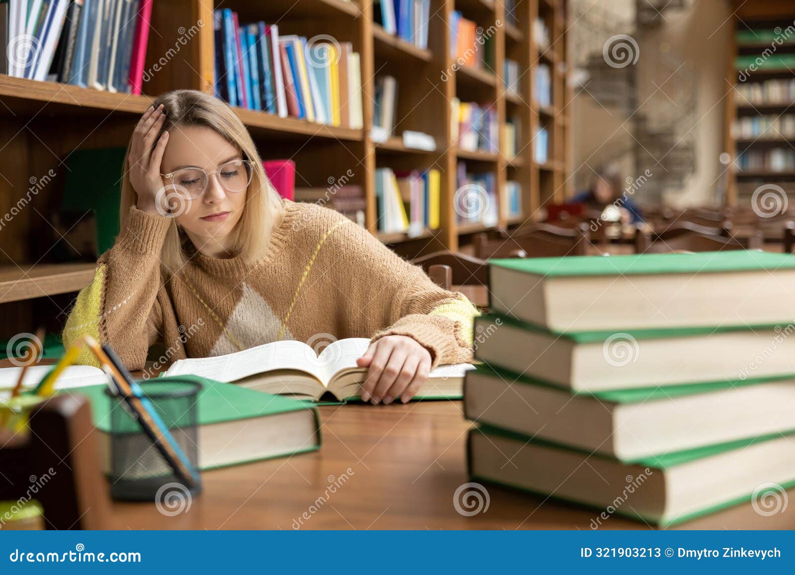Blonde Young Woman Studying in the Library Stock Image - Image of ...