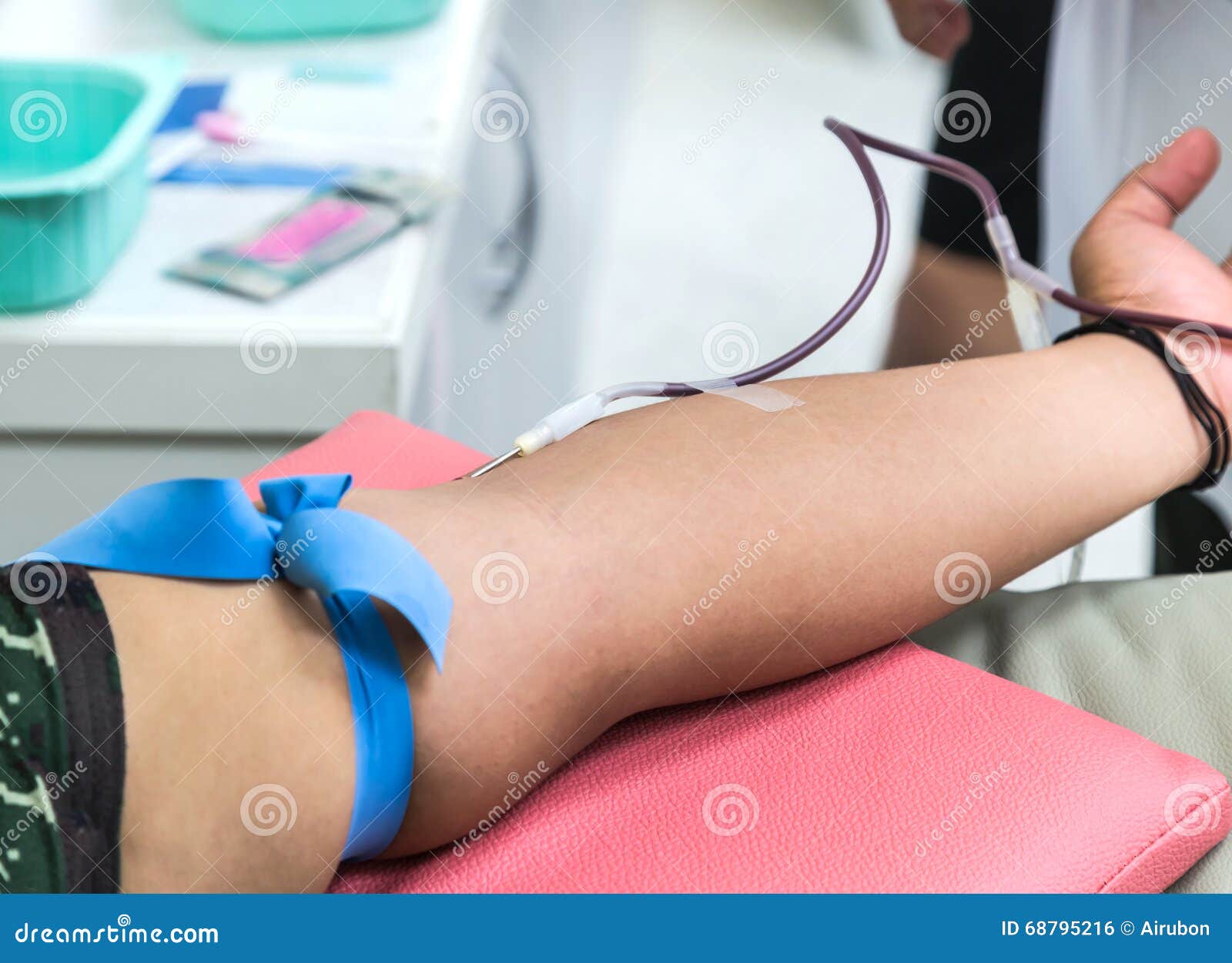 Blood Donor during the Transfusion with the Needle in the Arm . Stock ...
