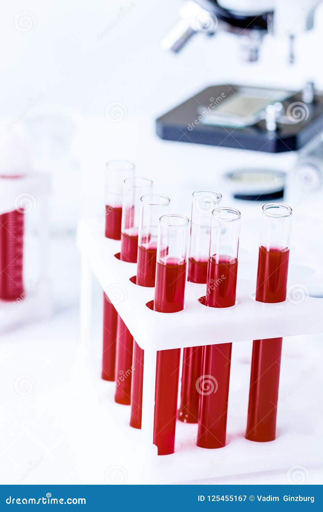 Blood in Glass Tubes on Background of Microscope Stock Image - Image of ...