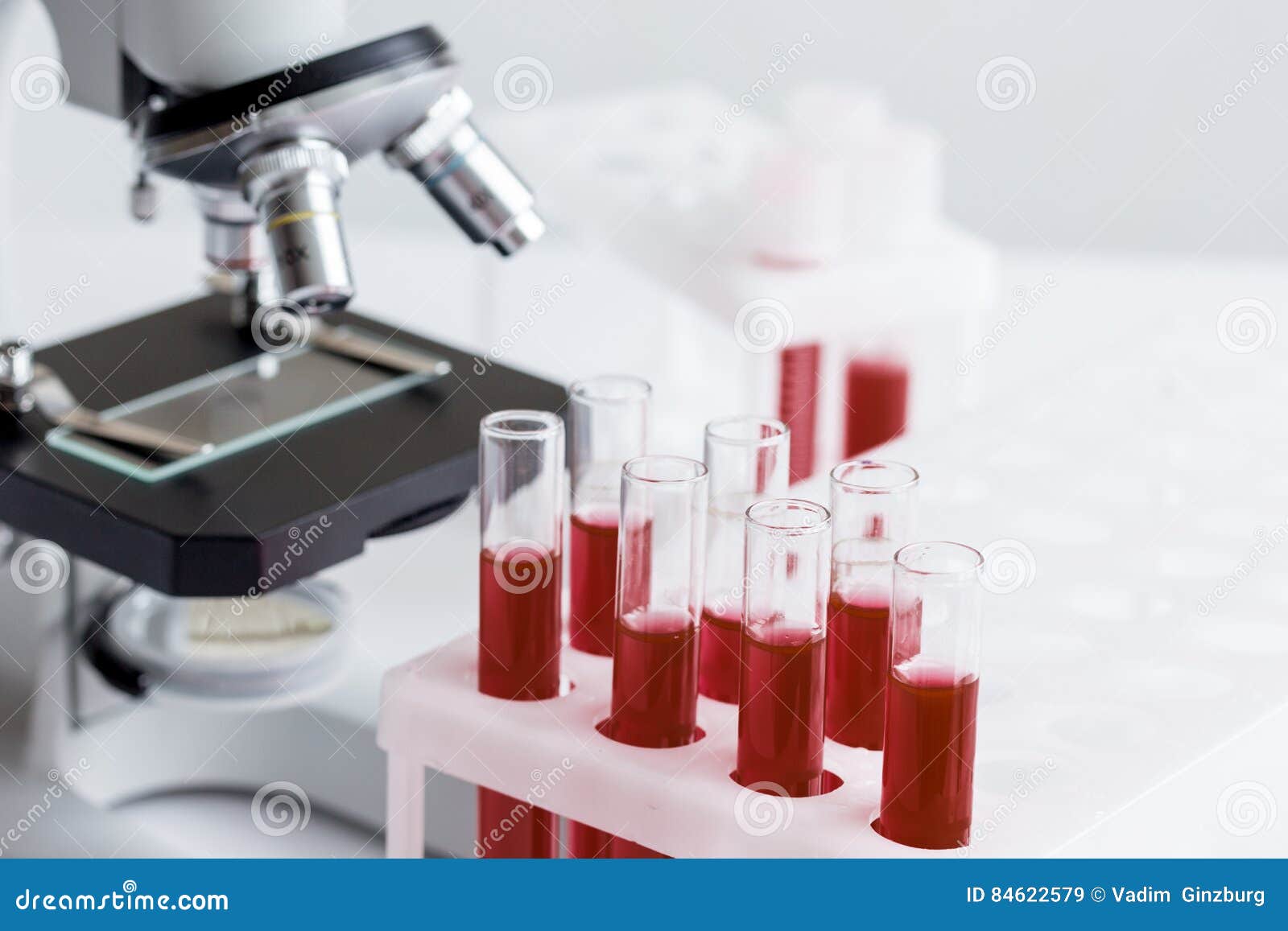 Blood in Glass Tubes on Background of Microscope Stock Image - Image of ...